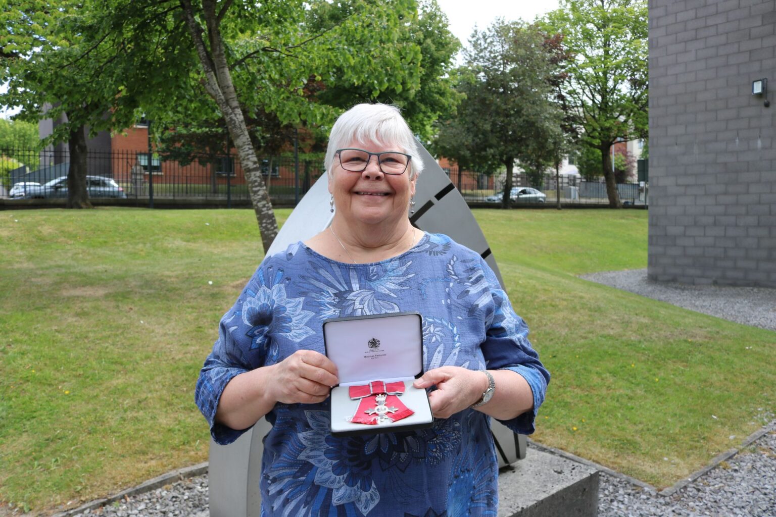 Former teacher honoured with MBE welcomed back to college - Tameside ...
