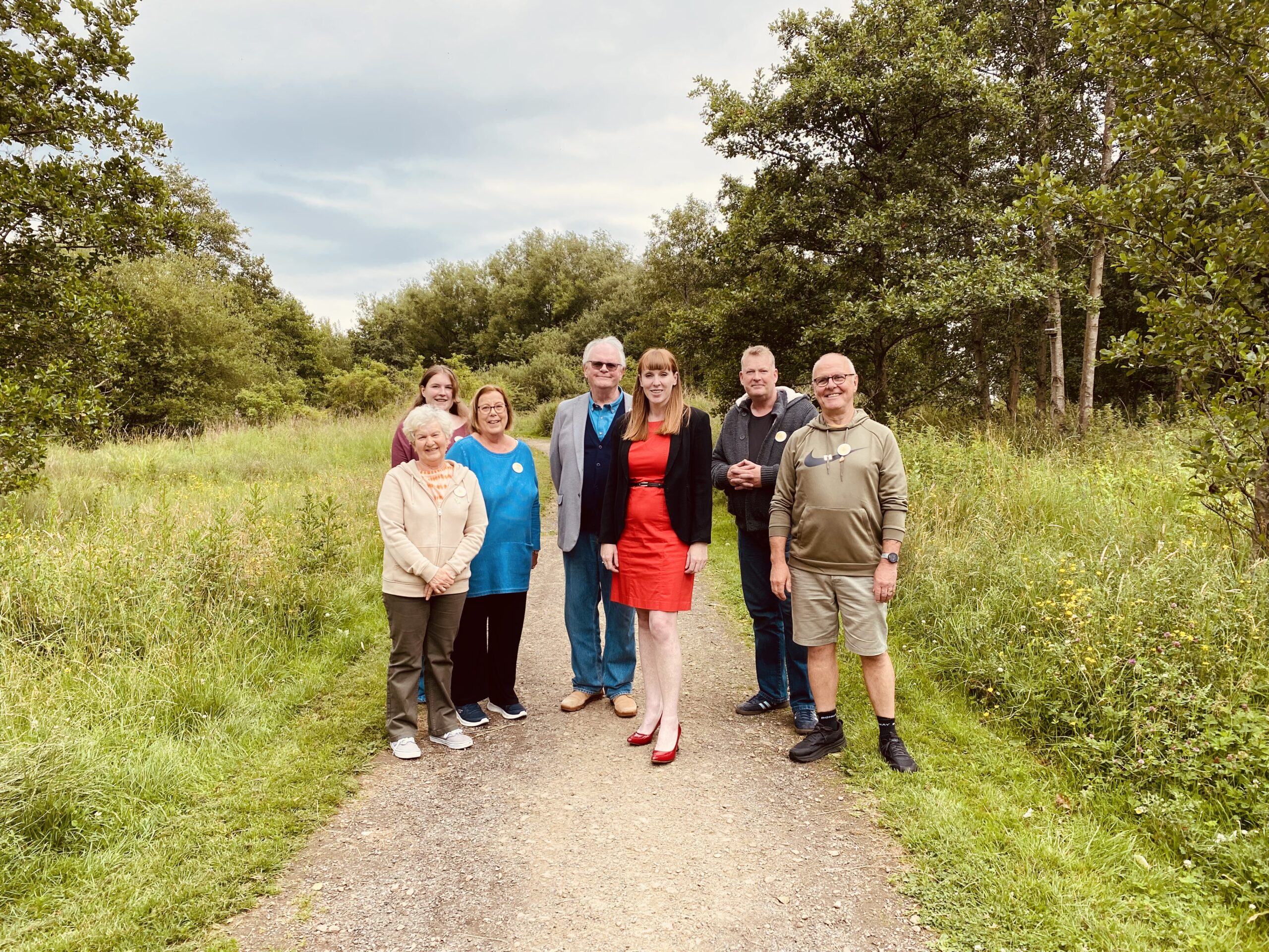 Deputy PM lauds volunteers on visit to popular green space - Tameside ...